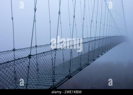 Foggy freezing winter morning, suspension bridge Stock Photo - Alamy