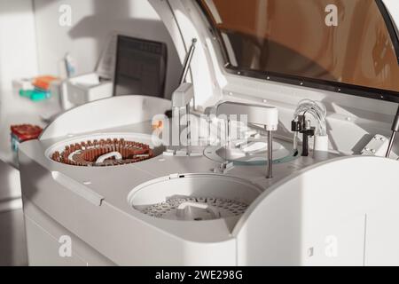 Microcentrifuge machine with test tubes standing in research laboratory ...