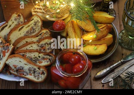 Festive table with meat pie, pate, potatoes and wine Stock Photo - Alamy