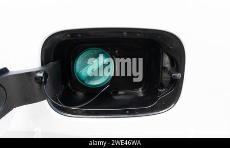 Fuel filler flap open with green diesel cap. Fuel tank cap of a car for ...