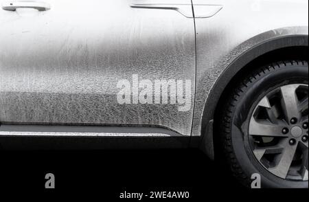 Side view of a very dirty car. Fragment of a dirty SUV. Dirty ...