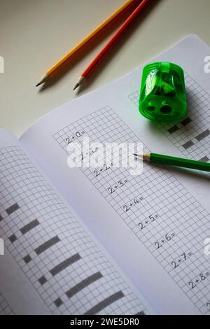 learning to count and write numbers correctly, notebook and pencils ...