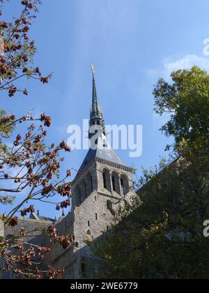 An elegant church featuring a tall steeple, intricate gothic ...