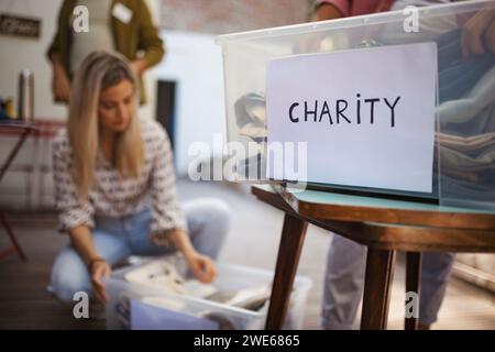 People collecting and sorting clothes for charity Stock Photo - Alamy
