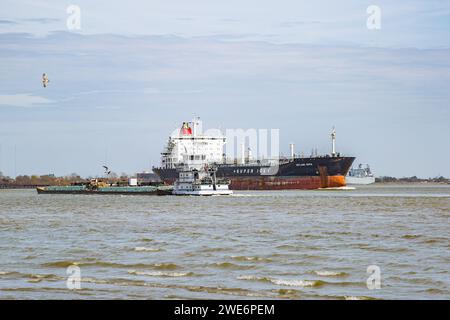 Joseph F Morrison tug boat pushing barges past the Gotland Sofia Oil Tanker ship on the ...