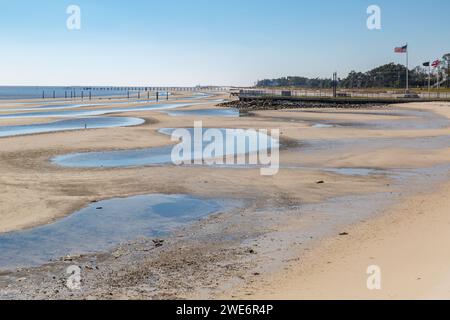Sand beach exposed in bands during low tide of the Gulf of Mexico at ...