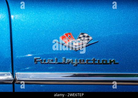 Fuel Injection emblem on fender of classic car Stock Photo - Alamy
