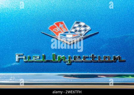 Fuel Injection emblem on fender of classic car Stock Photo - Alamy