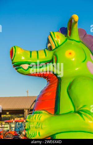 Colorful children's dragon roller coaster ride at the Gulf State Fair ...