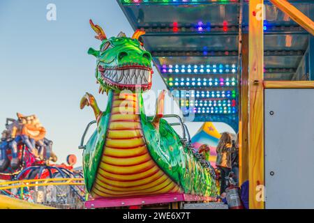 Colorful children's dragon roller coaster ride at the Gulf State Fair ...