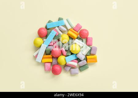 Different color chewing gums on yellow background Stock Photo - Alamy