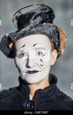 Dramatic closeup portrait of sad mime artist performing on stage with ...