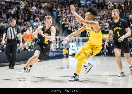 Purdue guard Fletcher Loyer (2) drives under Nebraska center Braxton ...