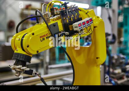 Close-up of an industrial robotic arm component with metal parts and ...
