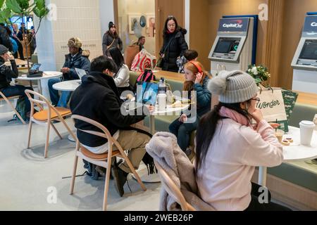 Customers and potential customers celebrate the grand opening of a ...