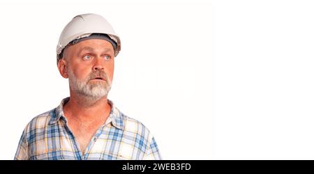 Surprased Surveyor builder site engineer in white hard hat in shock and ...