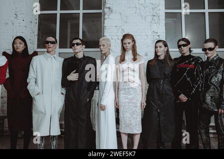 Fashion models in modern designer outfits posing on the backstage ...