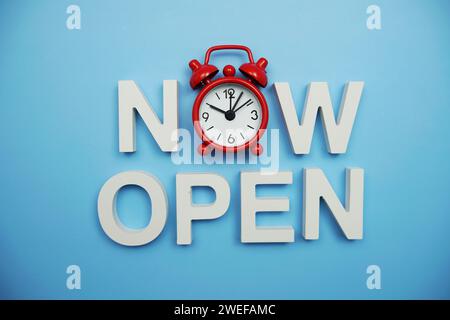 Now Open alphabet letters on blue background Stock Photo - Alamy