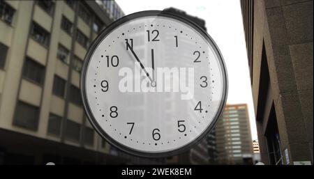 Image of clock ticking over cityscape Stock Photo - Alamy