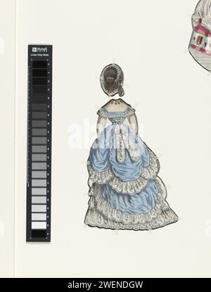 Back view of anonymous female in bright yellow coat walking on sandy ...