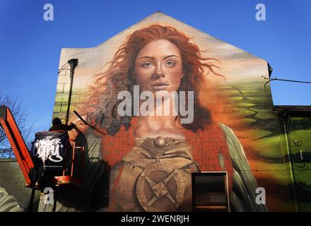 Street artist Mister Copy continues work on a mural depicting St ...