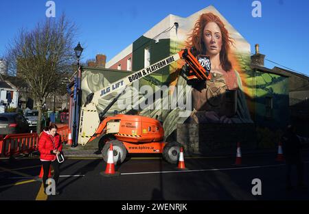 Street artist Mister Copy continues work on a mural depicting St ...