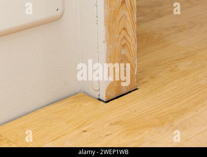 Detail of the parquet installation near the door frame Stock Photo - Alamy