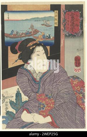 Japanese rowing in boats on the Imperial Palace canal to cherry blossom ...