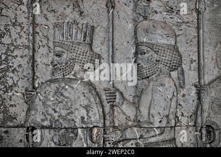 Relief of Persian and Median soldiers (the Mede wears rounded cap) in ...