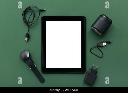 Composition with modern gadgets on green background Stock Photo - Alamy