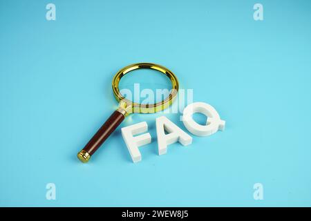 FAQ alphabet letters with magnifying glass on blue background Stock ...