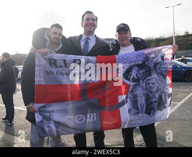 Millwall chairman James Berylson poses next to a road sign in tribute ...