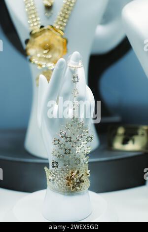 Gold jewelry is displayed at a store in Fuyang City, east China's Anhui ...