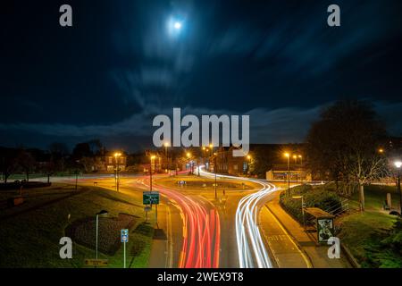 Night view of a busy small roundabout in a town Stock Photo - Alamy