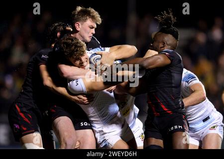 Zack Wimbush of Exeter Chiefs is tackled by Kieran Wilkinson of ...