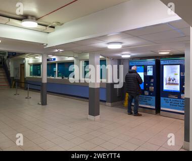 Banbury railway station ticket office with closed shutters and ticket ...