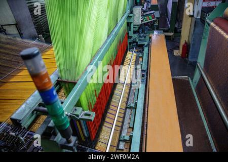 Modern Carpet weaving factory. Carpet making machine needle. Yarn ...