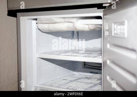 defrost refrigerator. melting ice in fridge Stock Photo - Alamy