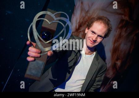 27 January 2024, Saarland, Saarbrücken: Joshua Bader holds his trophy ...