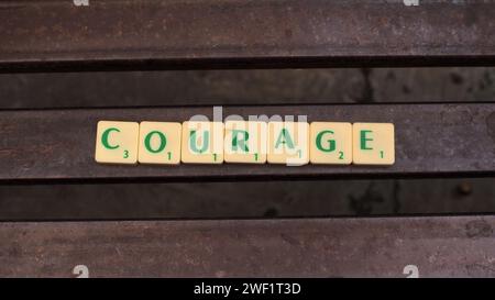 Scrabble letters spelling words Courage Stock Photo - Alamy