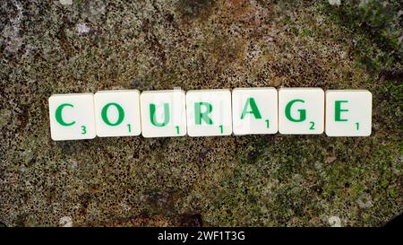 Scrabble letters spelling words Courage Stock Photo - Alamy