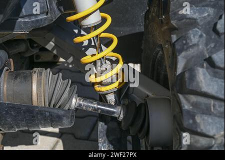 ATV rear suspension springs and shock absorbers Stock Photo - Alamy