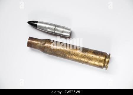 Armor-piercing bullet on a white background close-up, weapons and ...