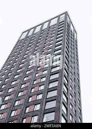 The image showcases the towering facade of a contemporary high-rise ...