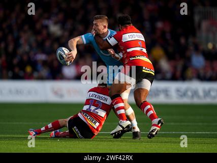 Sale Sharks' Sam Bedlow (centre) is tackled by Bristol Bears' Viliame ...