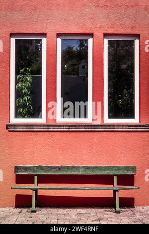Peach colored vintage building detail exterior with arched windows and ...