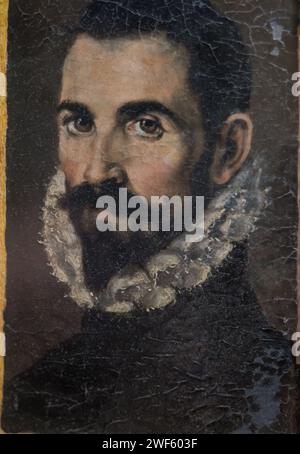 Young man with beard painting canvas at home pointing with hand finger ...