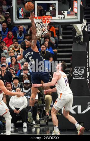 Orlando Magic forward Paolo Banchero (5) moves the ball past Toronto Raptors forward Scottie ...
