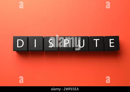Word Dispute made with black cubes on light blue background, top view ...