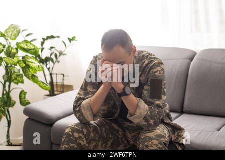 A distraught soldier covering his face, possibly suffering from shell ...